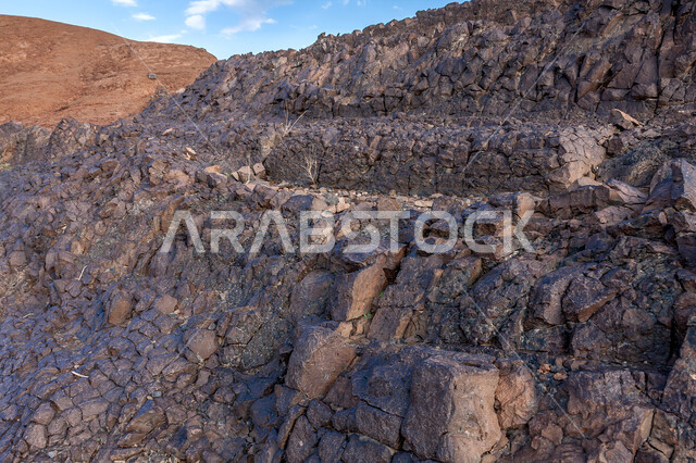 Lava on the slope of the Al Waabah volcanic crater in a clay quarry in ...