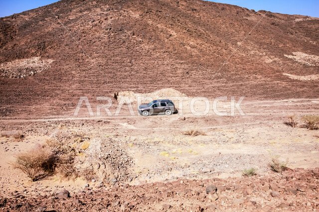 Dormant volcanic fields, an aerial photo of a four-wheel drive vehicle ...