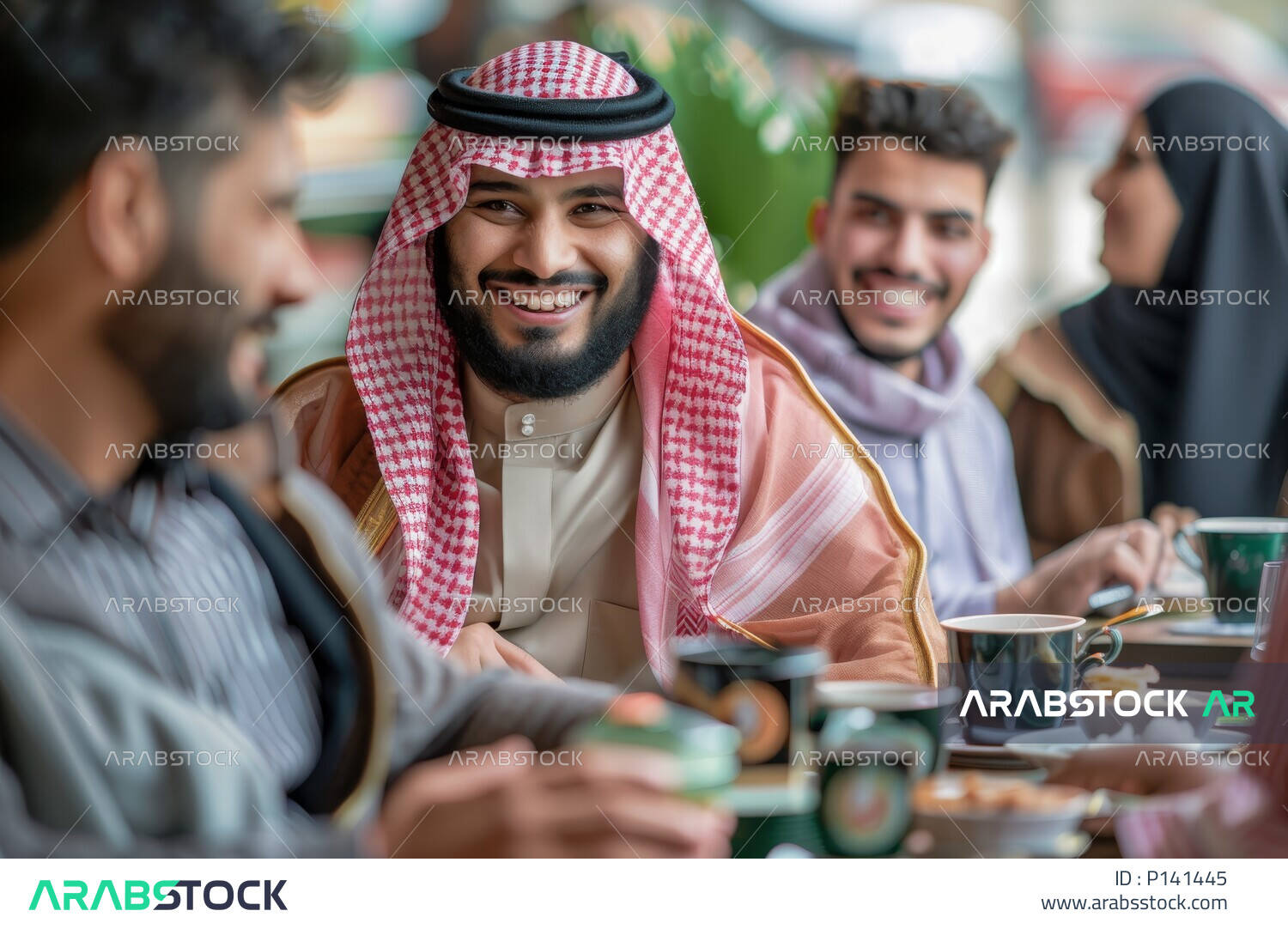 Cooperation in completing work, a close-up photo of a group of Saudi ...
