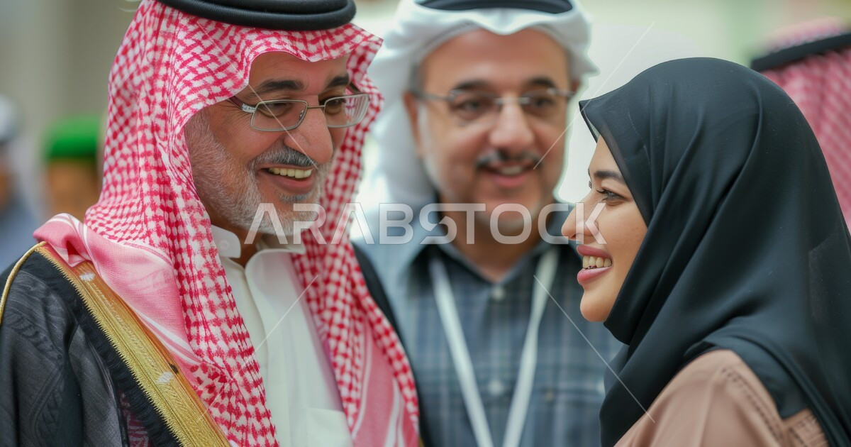 Cooperation in completing work, a close-up photo of a group of Saudi ...