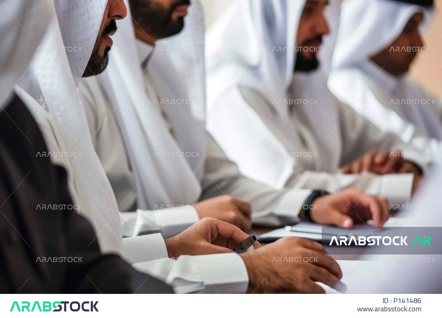 A group of Saudi Gulf Arab employees in a meeting inside the company’s ...