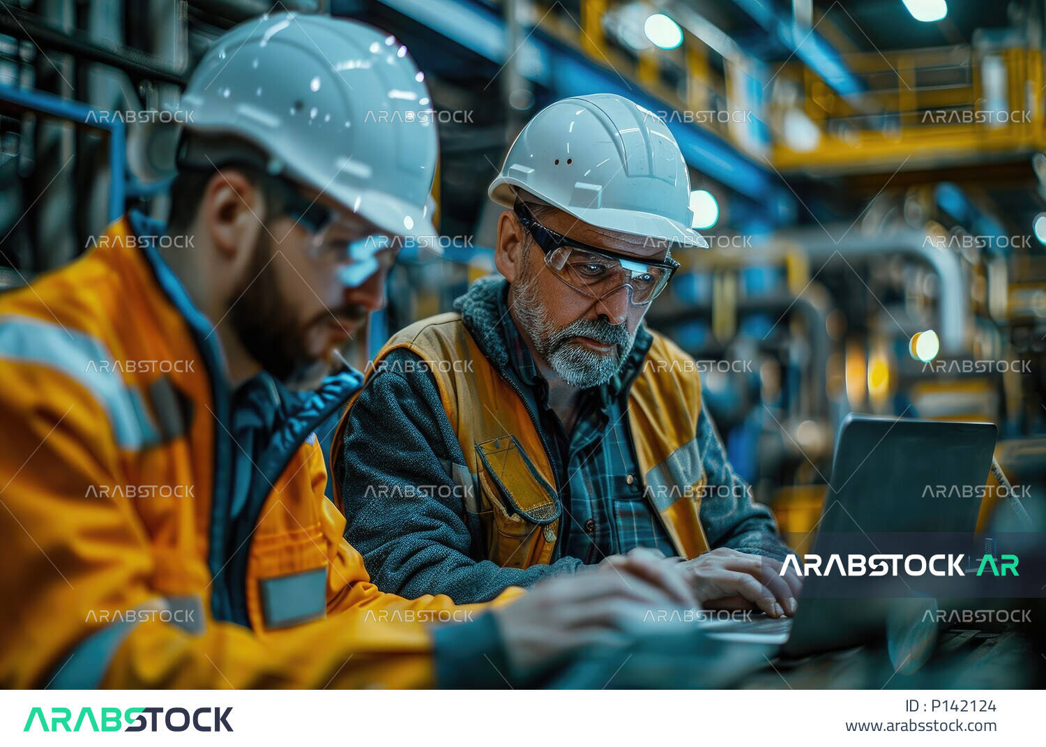 Two Saudi Gulf Arab engineers wearing a safety vest, glasses and a ...
