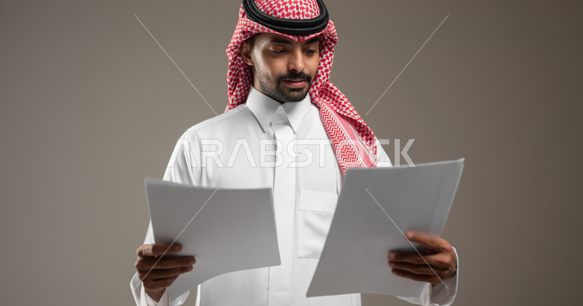 A close portrait of a Saudi Gulf Arab man wearing Saudi uniform ...