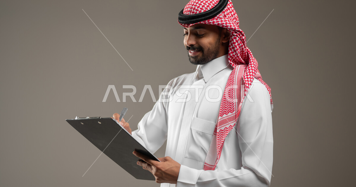 A Saudi Gulf Arab man in Saudi uniform, responsible for supervising ...