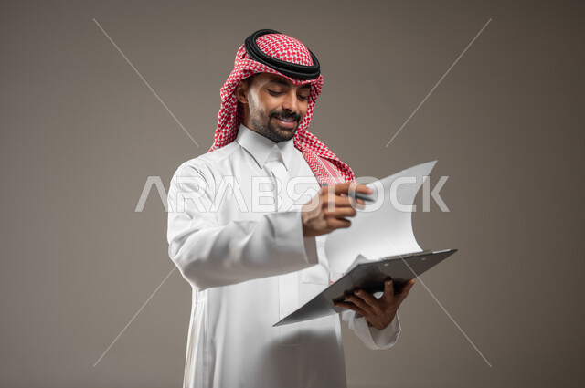 A close-up portrait of a Saudi Gulf Arab man wearing Saudi uniform ...