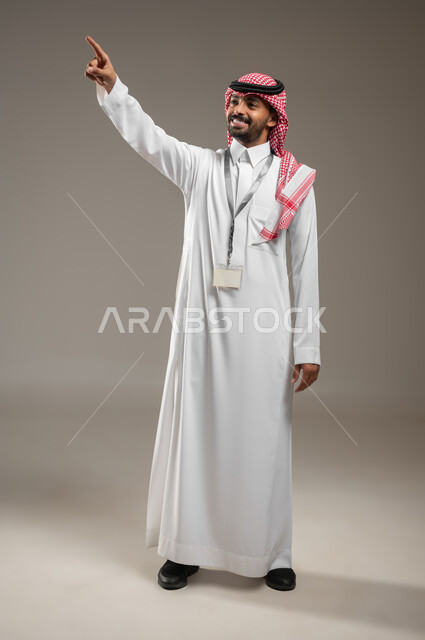 A full-length portrait of a Saudi Gulf Arab man in Saudi uniform ...