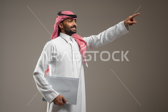 Close side portrait of a Saudi Gulf Arab man wearing Saudi uniform ...