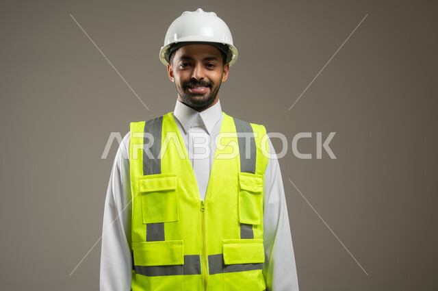 Close-up portrait of a Saudi Arabian Gulf engineer wearing a safety ...