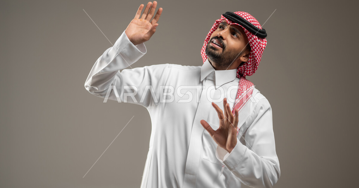 Fear and dread, a close-up portrait of a Saudi Gulf Arab young man ...