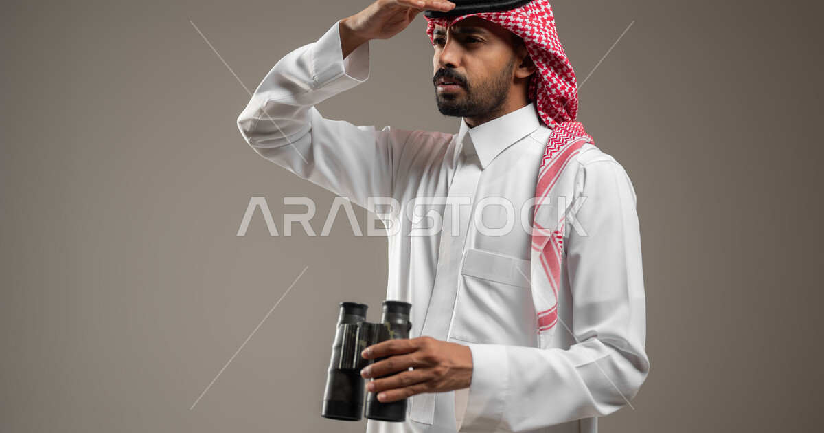 A close-up portrait of a Saudi Arabian Gulf man wearing Saudi uniform ...