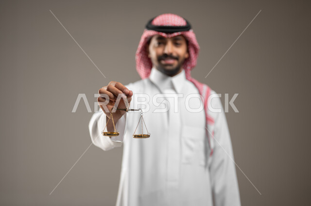 A close-up portrait of a Saudi Gulf Arab man wearing Saudi uniform ...