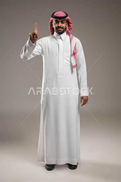 Portrait of a Saudi Gulf Arab man wearing the Saudi white thobe ...