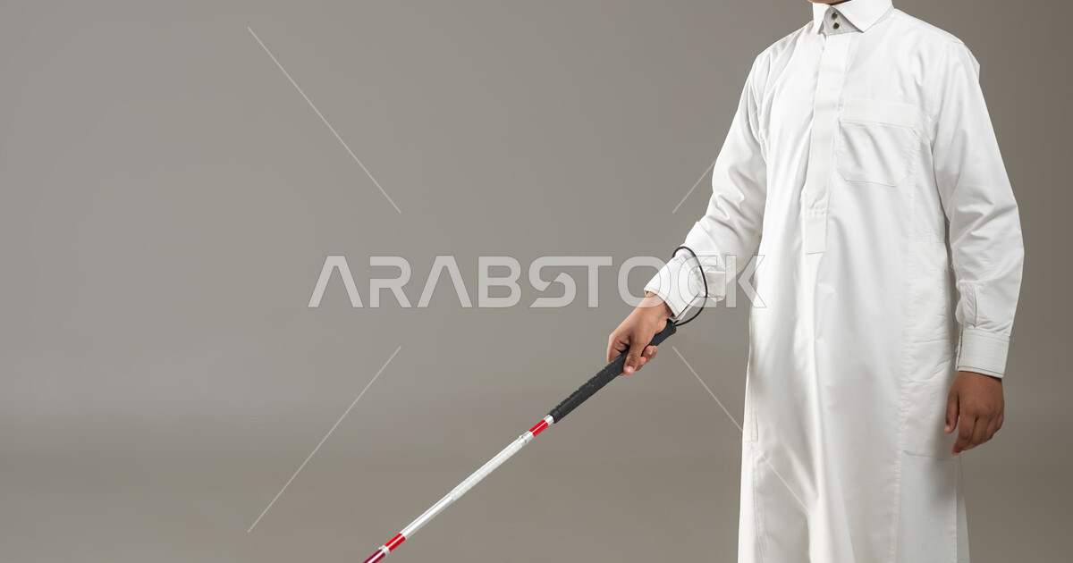 A blind person's complete dependence on a white cane in all his ...