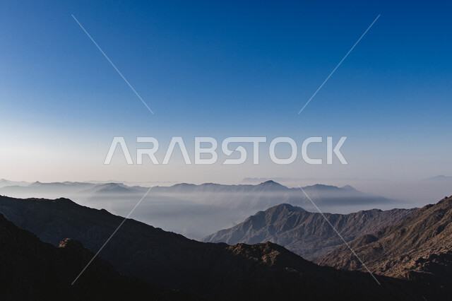 A view of the foggy sky during the day over the Soudah Mountains in ...
