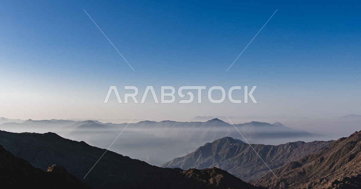A view of the foggy sky during the day over the Soudah Mountains in ...