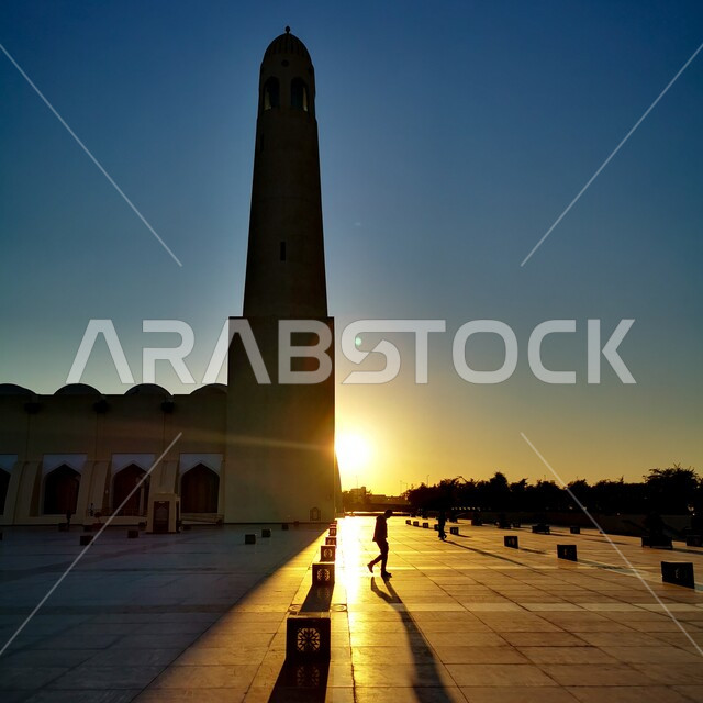 The building of the Imam Abdul Wahhab Mosque illuminated at sunset in ...
