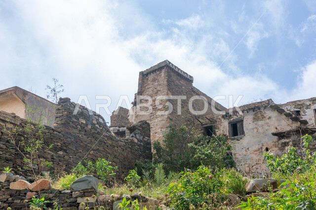Green plants and trees, stone houses and buildings in heritage villages ...