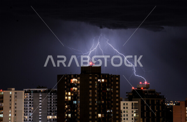 Disasters and natural phenomena, a thunderstorm hitting towers and ...