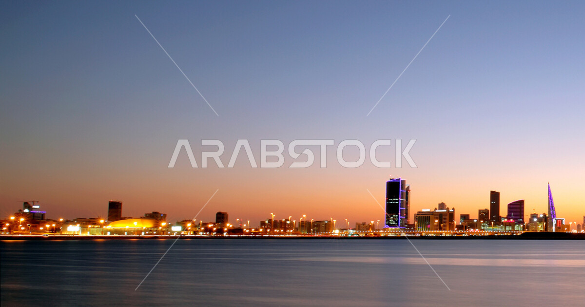 The waterfront of the city of Manama in Bahrain at sunset, tranquil ...