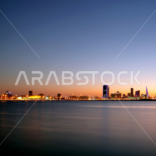The waterfront of the city of Manama in Bahrain at sunset, tranquil ...