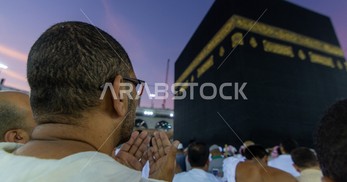 Performing Hajj and Umrah rituals, circumambulating the Holy Kaaba, a ...