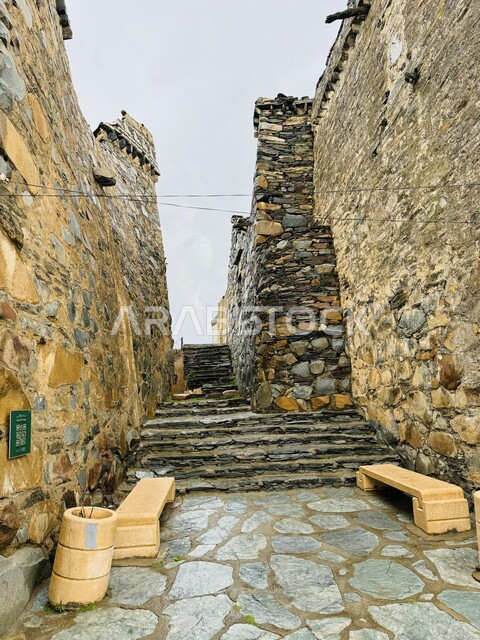 Roads and stone houses in the village of Al-Dhafeer in Al-Baha region ...