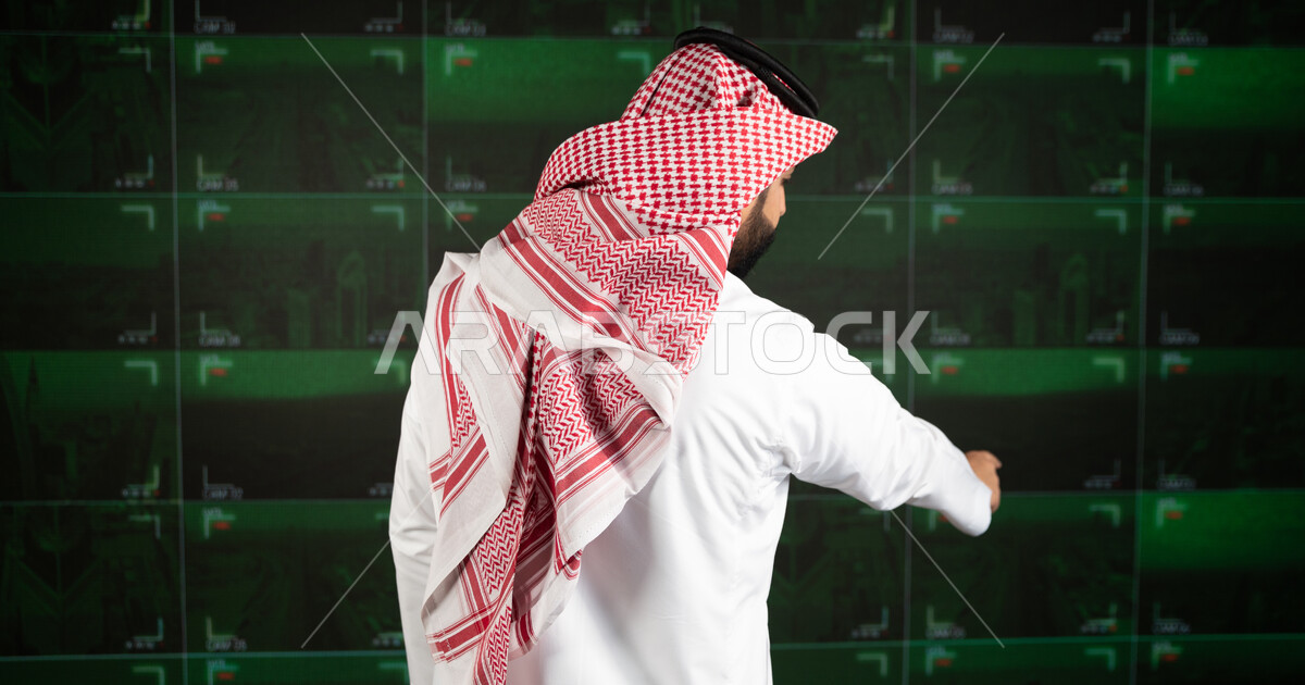 A Saudi Gulf man runs the security section, tracks surveillance cameras ...