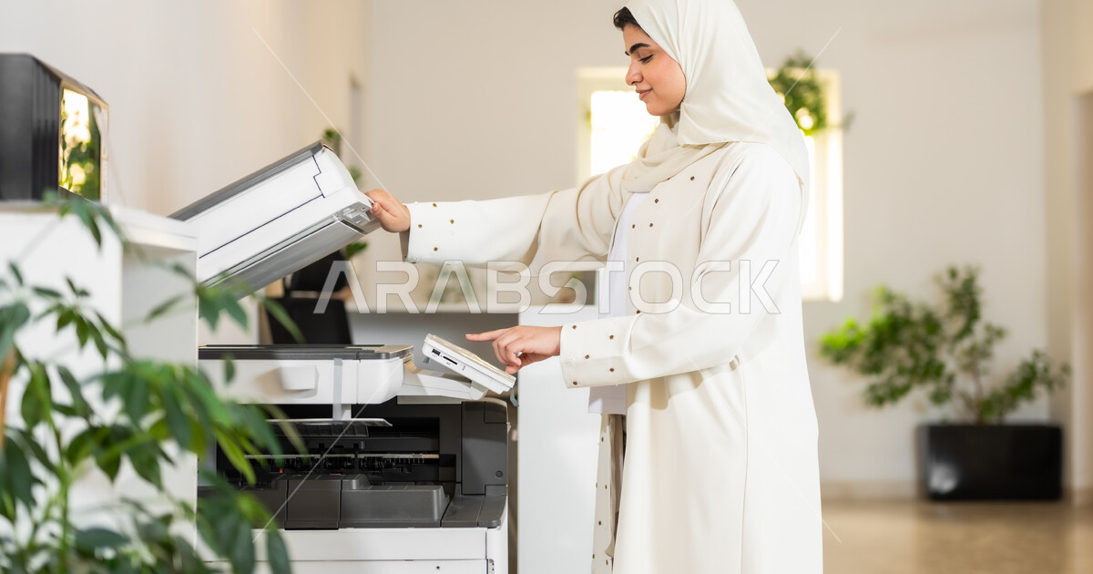 The use of modern technical devices and machines in offices, female ...