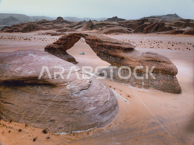 The famous Arch Rock in the desert areas of the Kingdom of Saudi Arabia ...