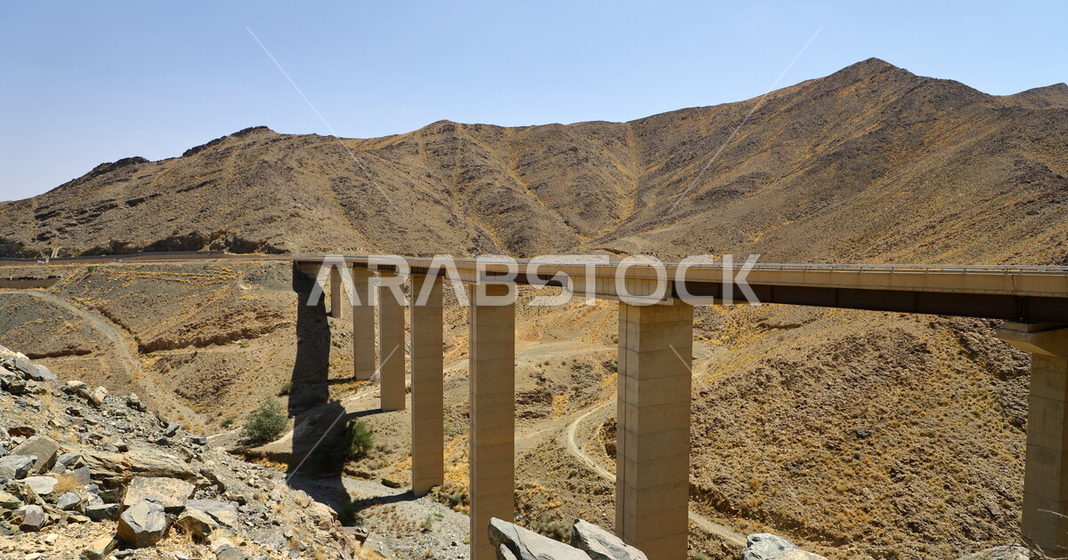 Passage bridge between mountains in the middle of the desert, Saudi ...