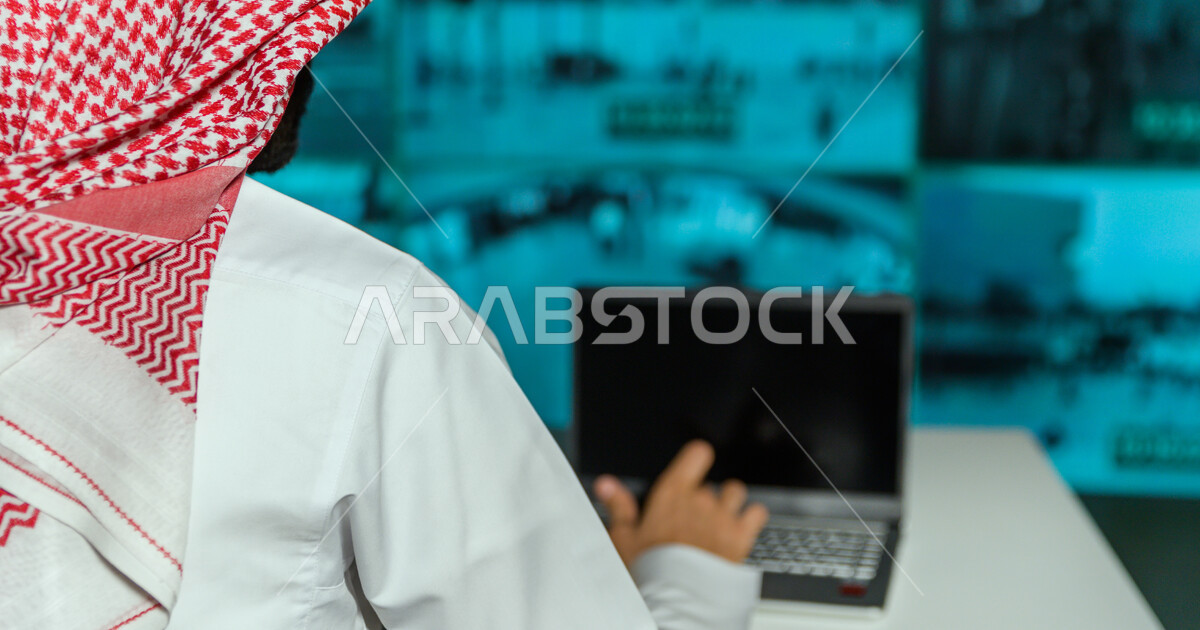 A Saudi Gulf man runs the security section, tracks surveillance cameras ...
