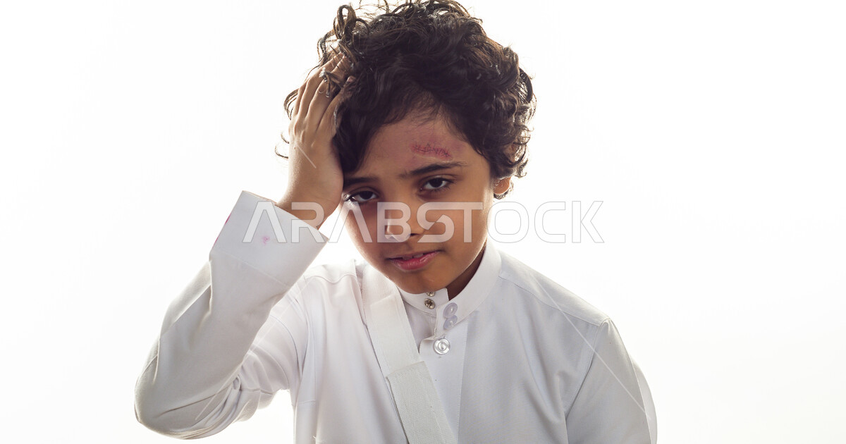 Portrait of a Saudi Gulf child with several problems in the face area ...