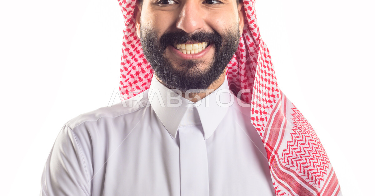 Portrait of a happy Saudi Gulf man, a Hollywood smile, using porcelain ...