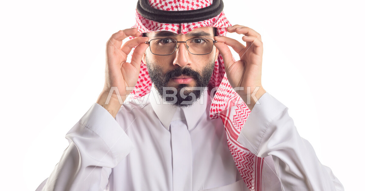 Portrait of a Saudi Arabian Gulf man with medical glasses, wearing ...