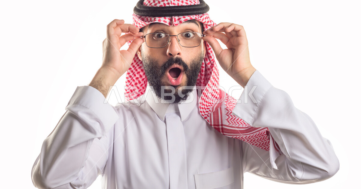 Portrait of a Saudi Arabian Gulf man with medical glasses, wearing ...
