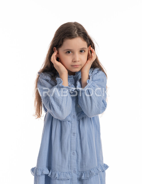 Gestures of not wanting to listen, a Saudi girl standing with an ...