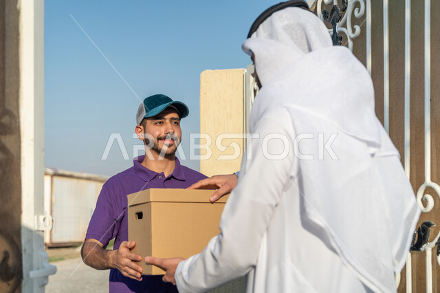 Delivery of goods and orders, a close-up photo of an Arab Emirati Gulf ...