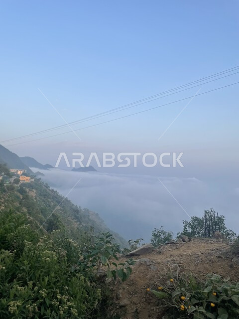 Highlands and mountain peaks in Jabal al-Aswad in the Jazan region, fog ...