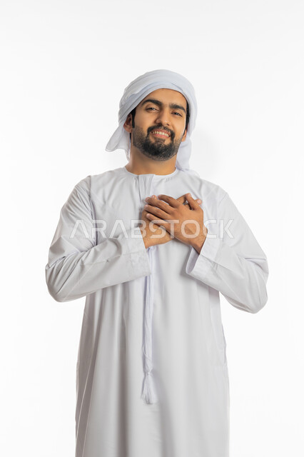 Falling in love, a portrait of a young Arab Gulf Emirati man wearing a ...