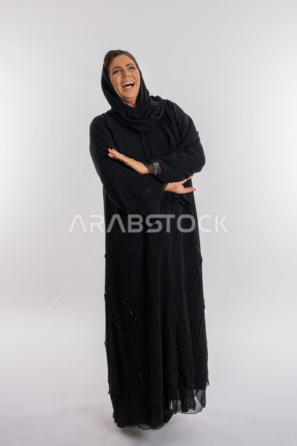 Expressions of hysterical laughter, portrait of a veiled Saudi Arab ...