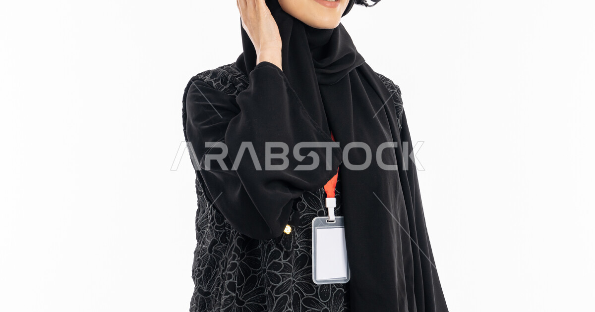 Wearing a personal badge with a red ribbon, looking at something with gestures of joy and joy, a ...