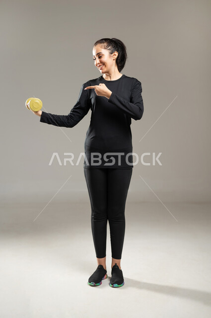 Pointing with the index finger at dumbbells with expressions of ...