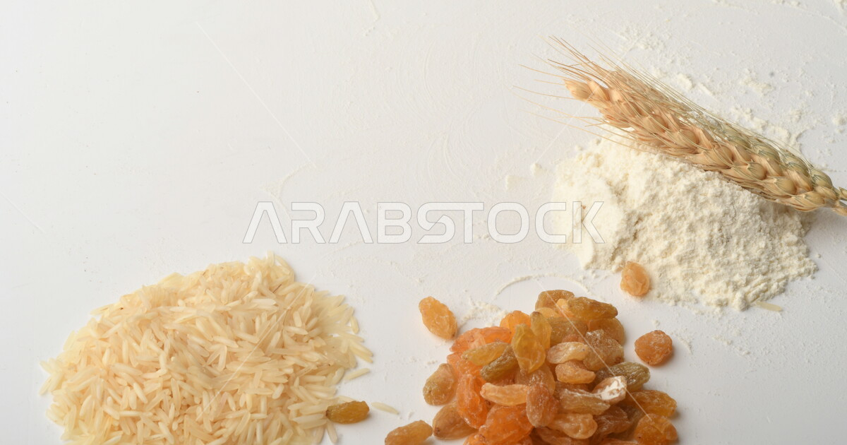 A group of rice, raisins, wheat, flour and coins depicted on a white ...