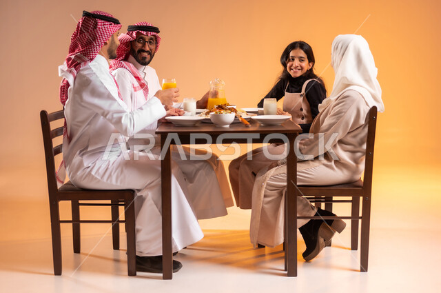 Family gathering at the dining table, a portrait of a Saudi Gulf Arab ...
