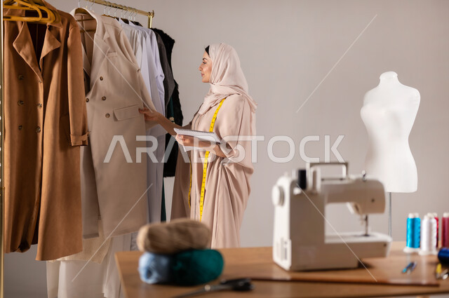 Sewing and tailoring skills, women’s clothing design shop, close-up ...