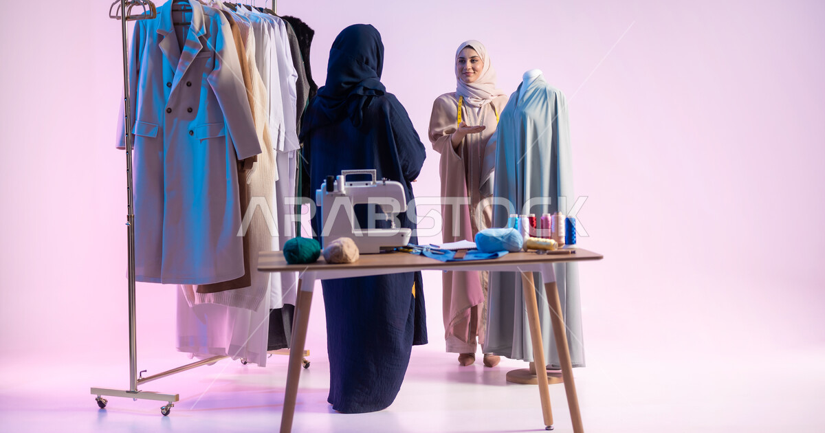 Practicing the profession of sewing, mastering the Saudi clothing ...