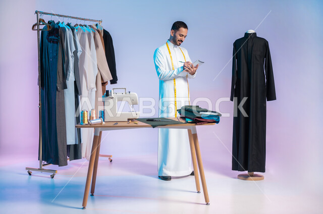 Recording and noting the measurements in the notebook, a portrait of a ...