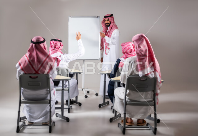 Active participation of students, portrait of a Saudi Gulf Arab teacher ...