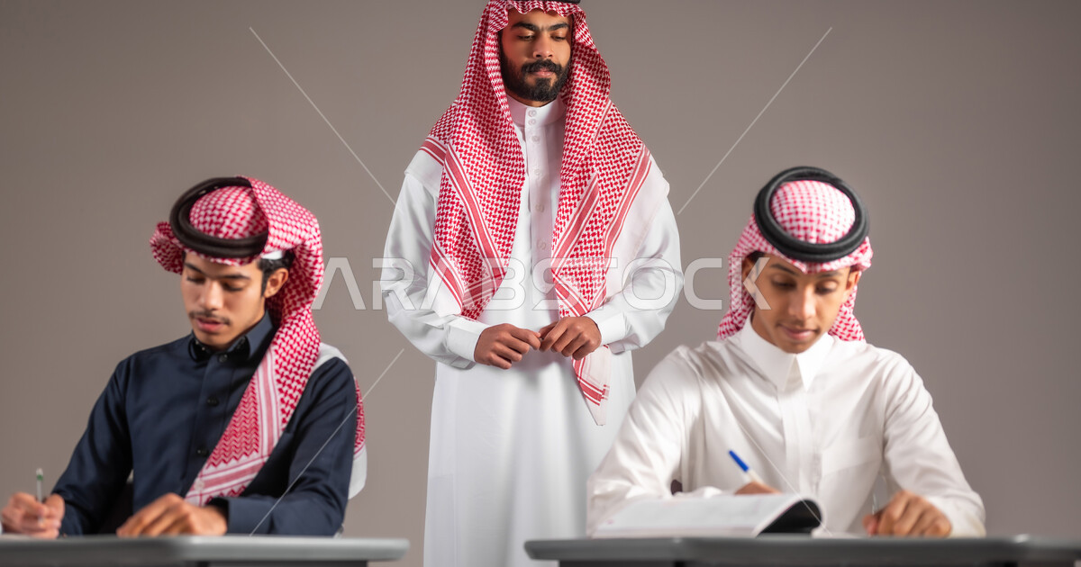 End-of-semester exams, close-up portrait of a Saudi Gulf Arab teacher ...