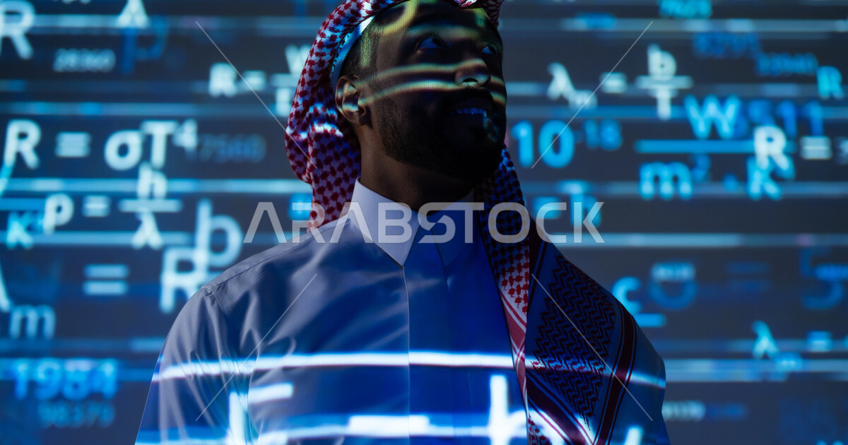 Numbers and calculations in mathematics, a Saudi Gulf Arab man wearing ...